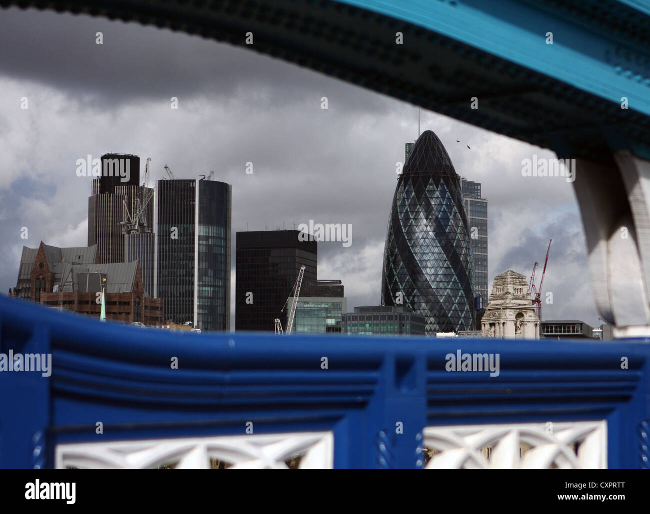 The city of London viewed through the structure of Tower Bridge Stock ...
