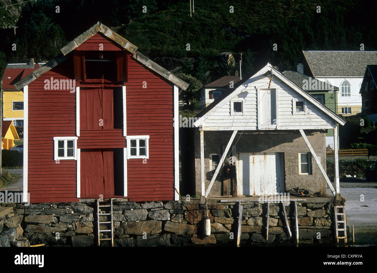 Norway, Runde Island, the pretty harbour and old warehouse buildings at ...