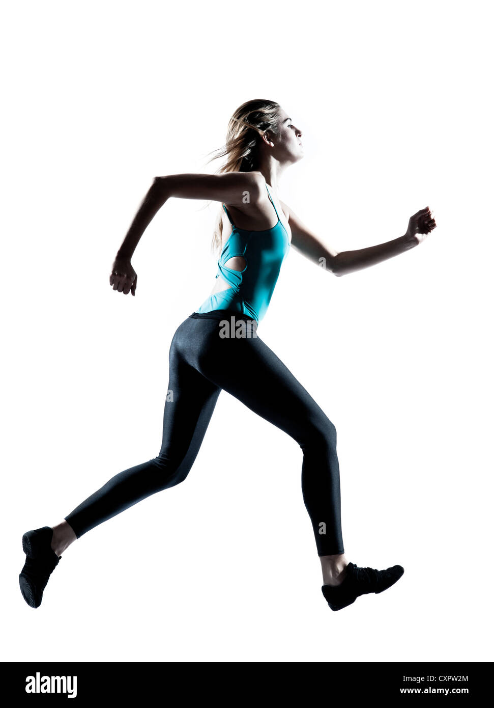 Side view of a young sporty woman jogging isolated on white background ...