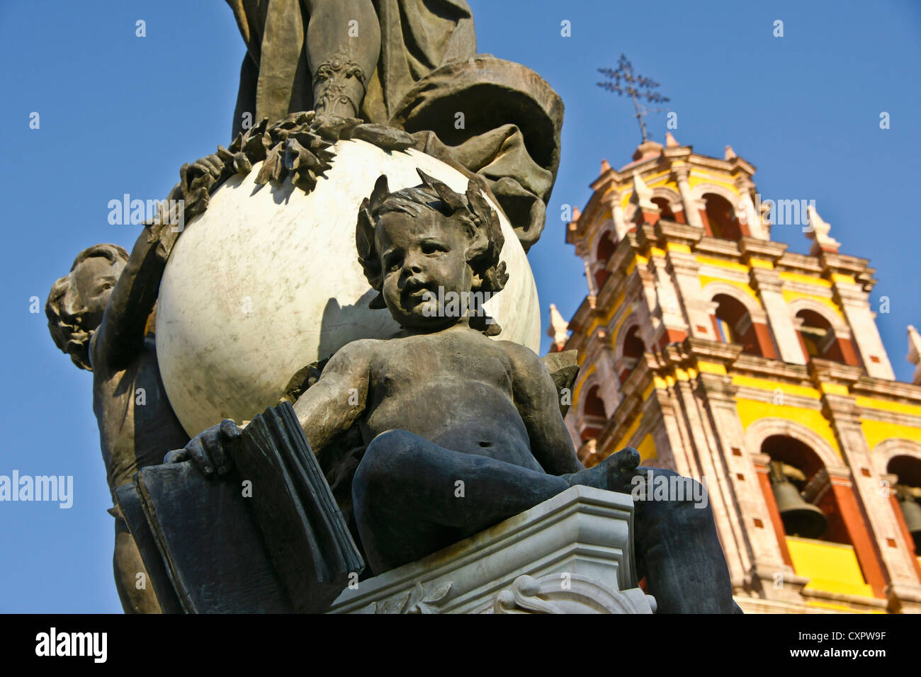 Cherub figure on staute on fountain in front of Basilica of Our Lady of ...