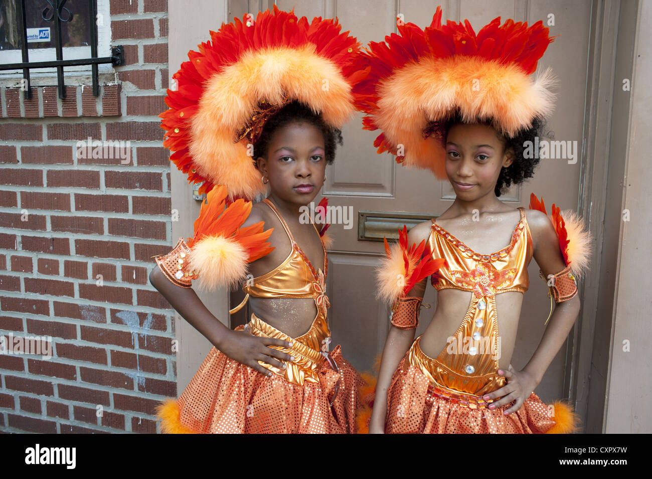 USA: Brooklyn, NY. Costumed girls pose for photo before marching in the ...