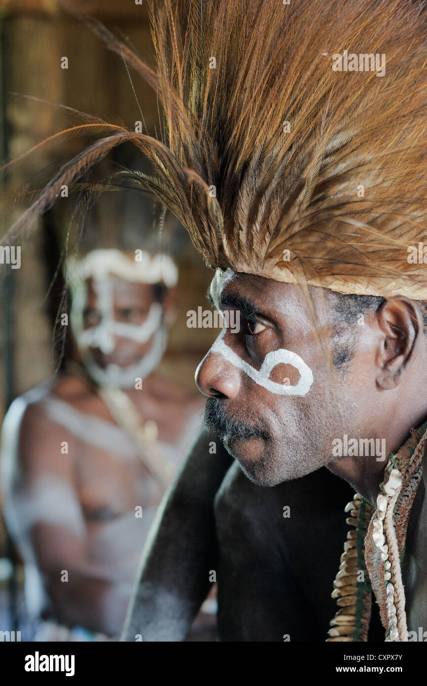 The Portrait Asmat with a traditional painting and coloring on a face ...