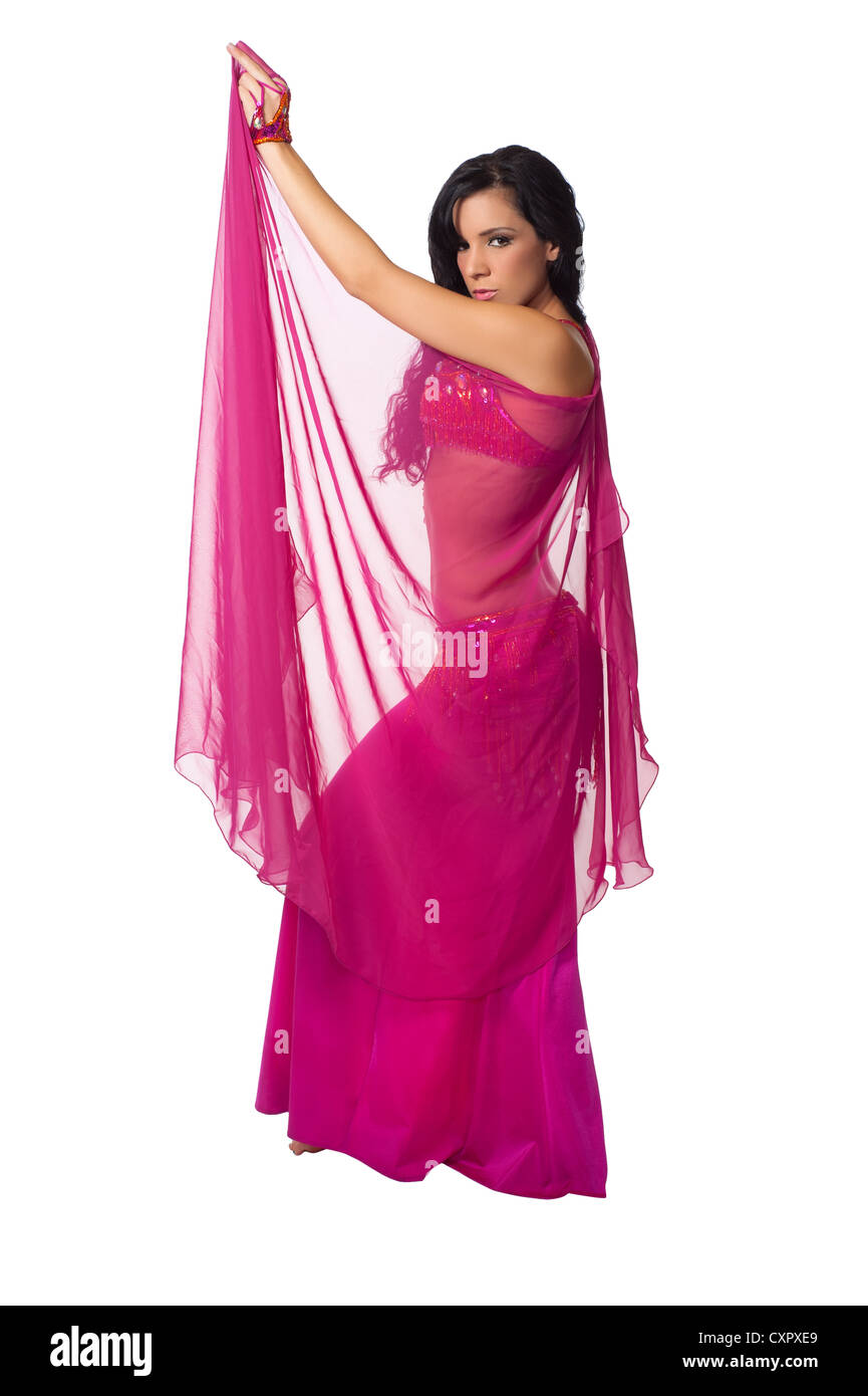 Exotic belly dancer wearing a hot pink costume and wrapped in a hot ...