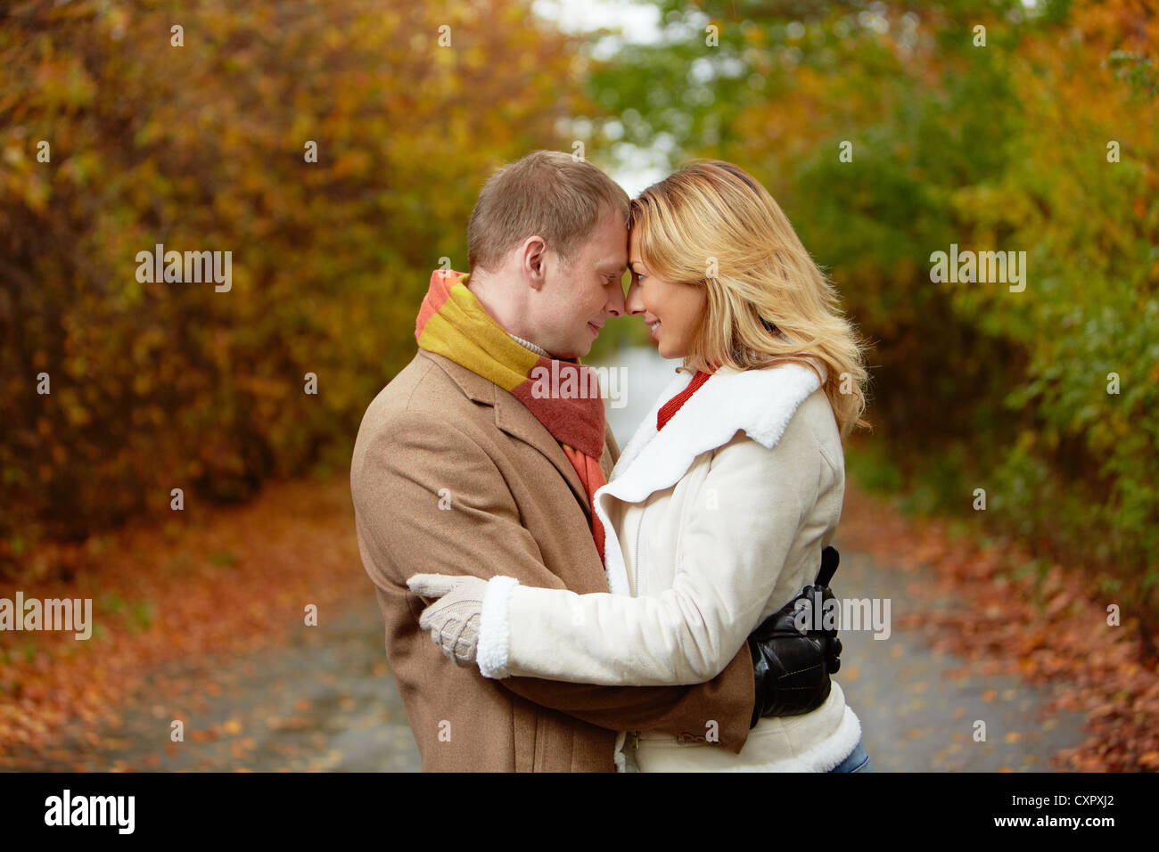 Romantic couple standing face hi-res stock photography and images - Alamy