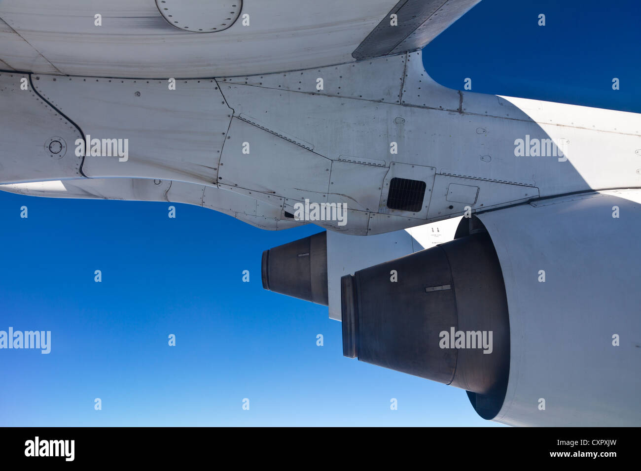 Two jet engines on an Avro RJ100 aircraft against a blue sky Stock ...