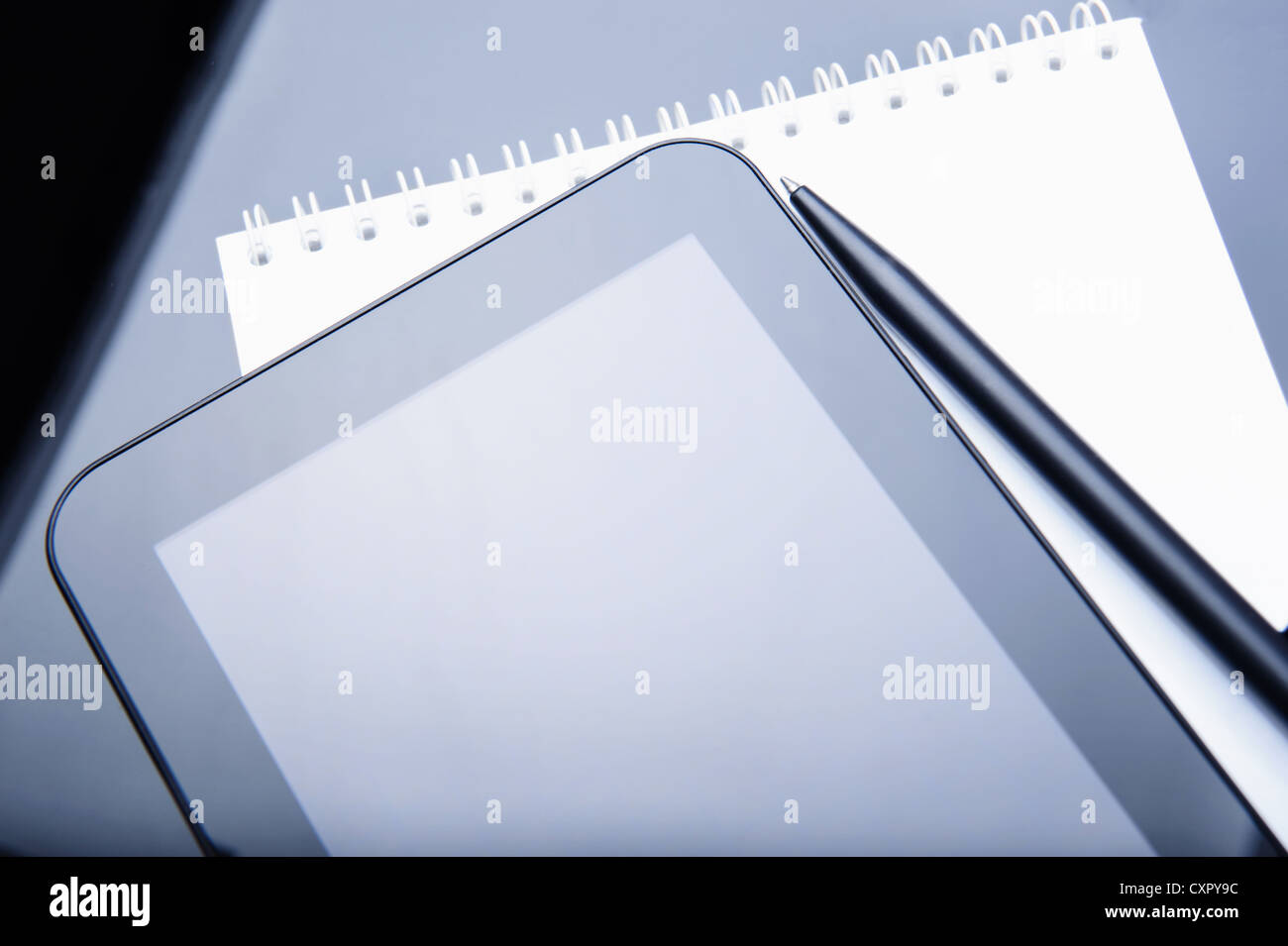 Digital tablet and notebook are on the desk Stock Photo - Alamy