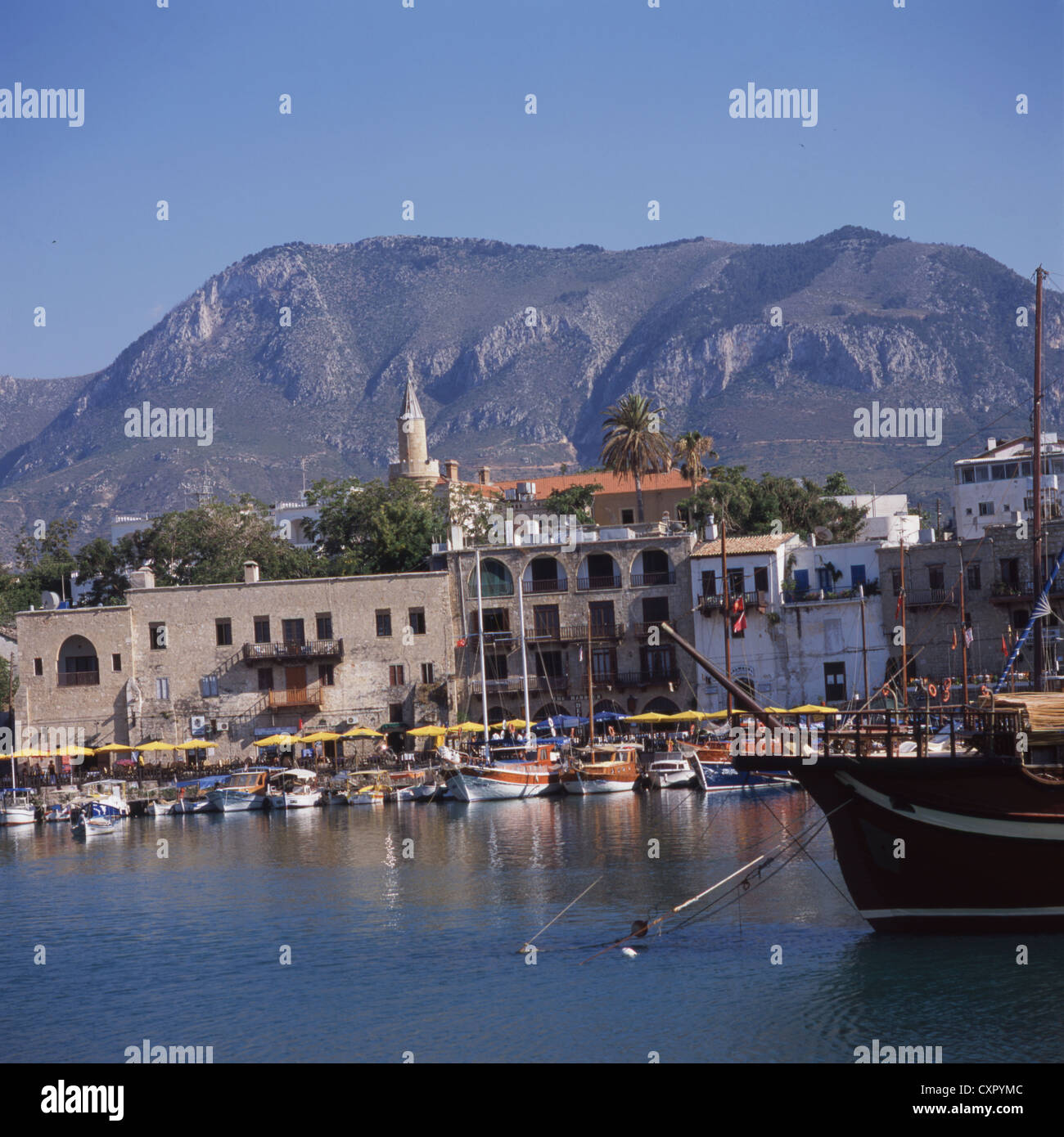 Kyrenia Harbour, with boats and mountains in background Stock Photo - Alamy