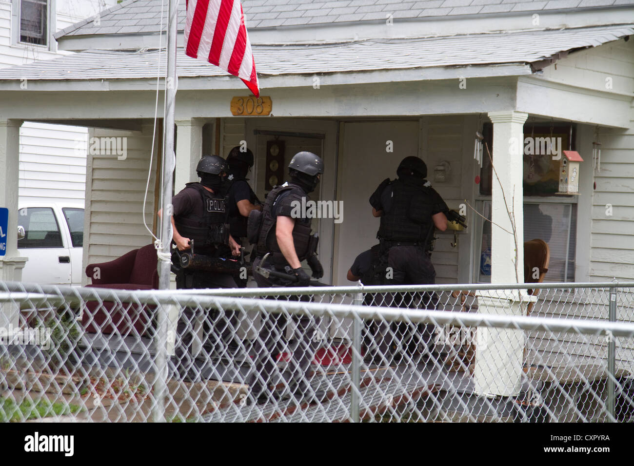 Police Tactical team serving high-risk narcotics related search warrant ...
