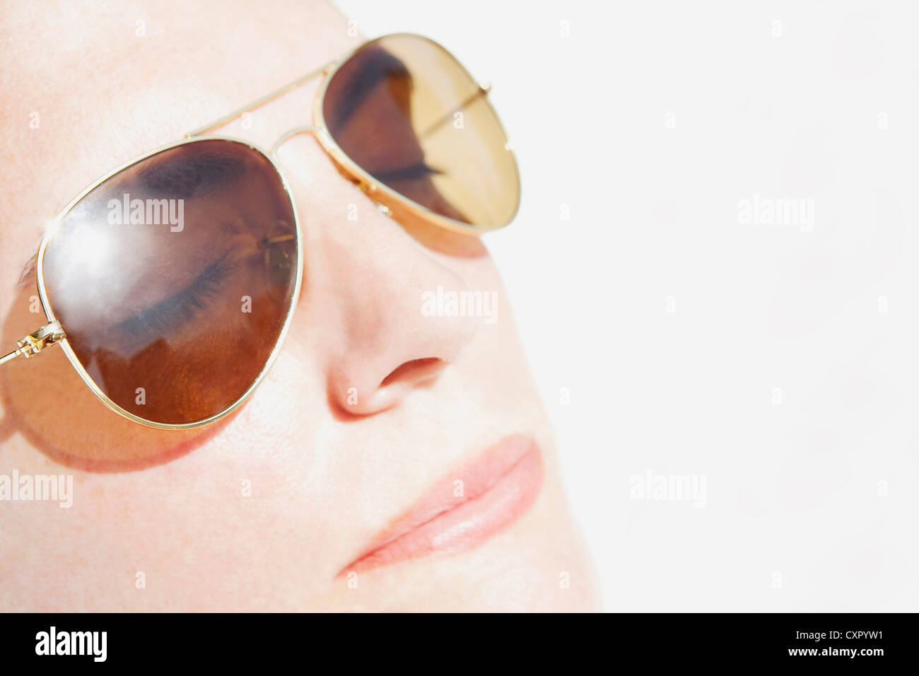 Woman's face in sunlight Stock Photo - Alamy