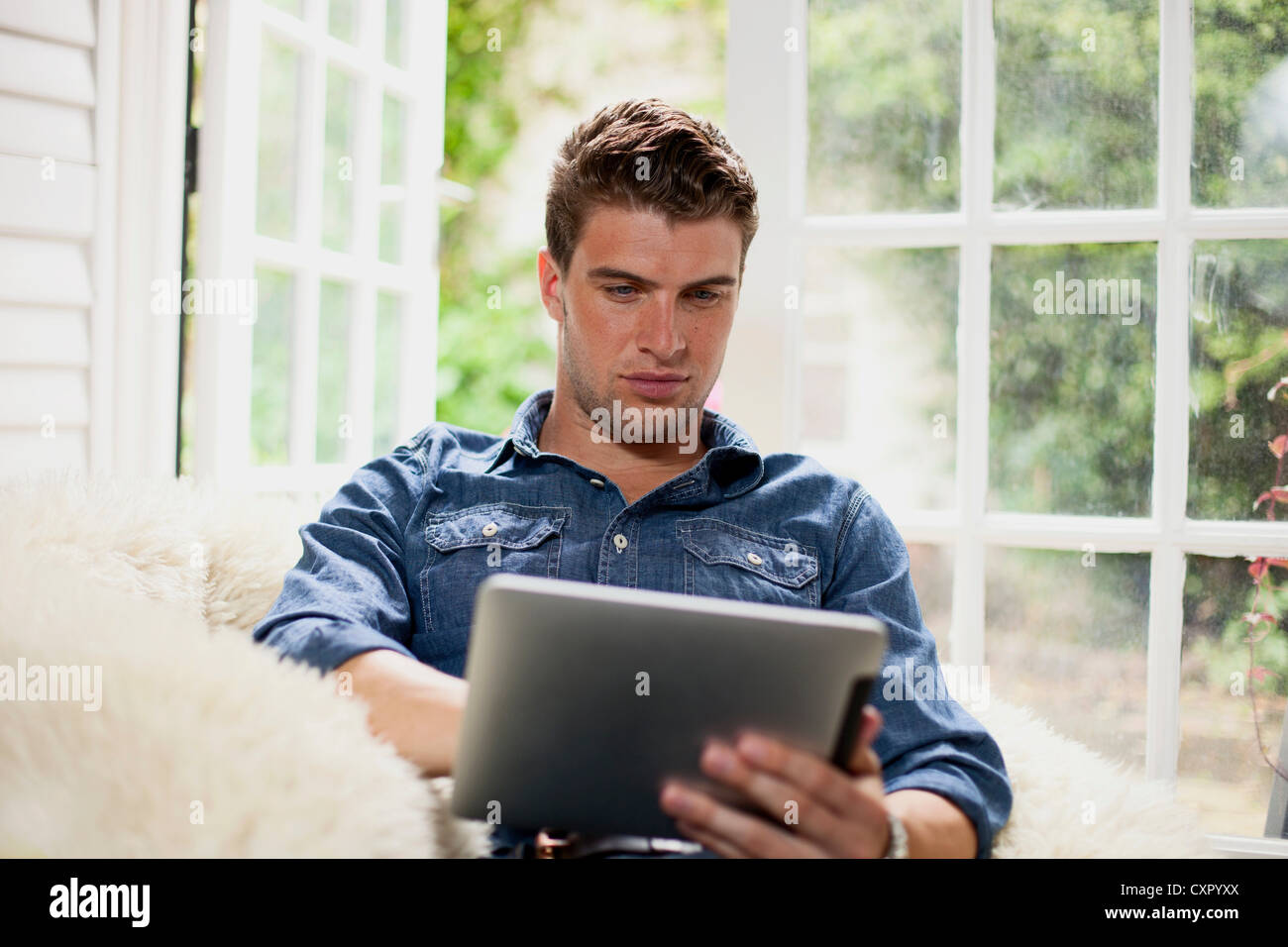 Young man with digital tablet Stock Photo - Alamy