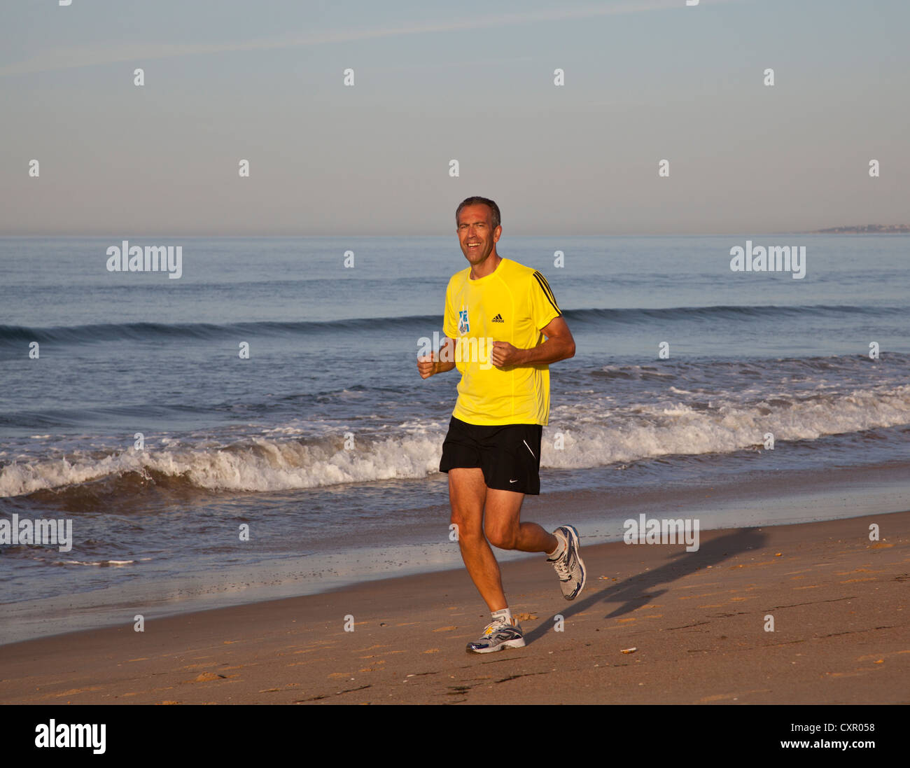 Jogging at sunrise Stock Photo - Alamy