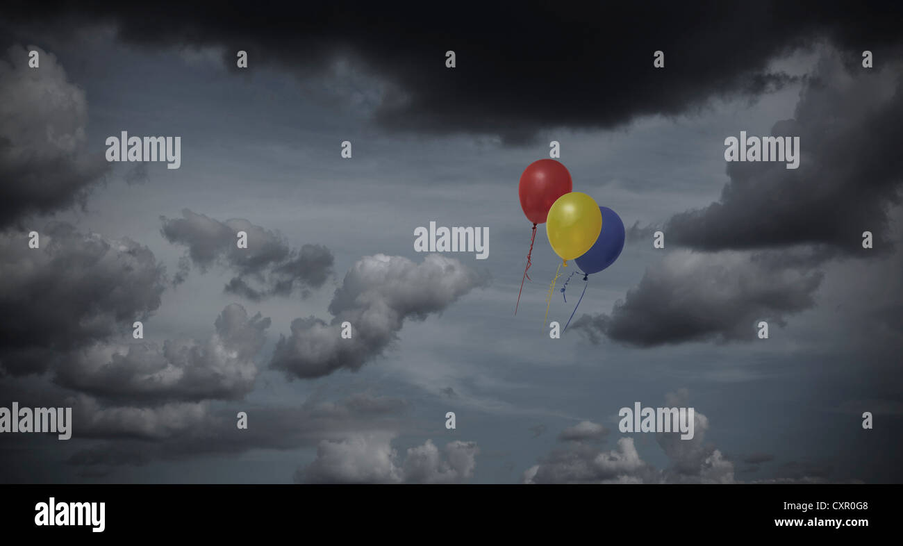 Balloons floating through dark sky Stock Photo - Alamy
