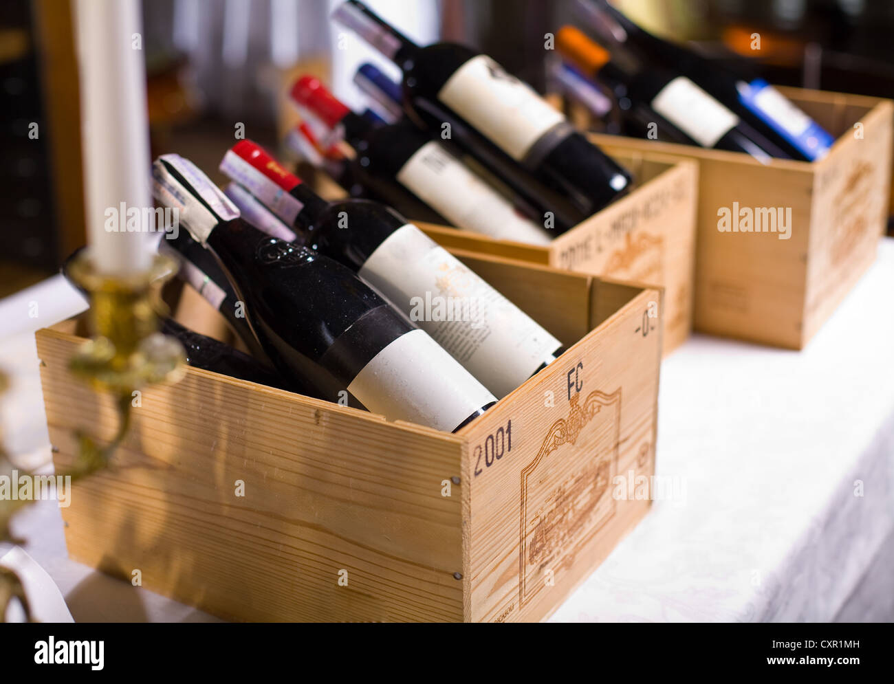 Wine bottles in wooden boxes are on the table restaurant Stock Photo ...