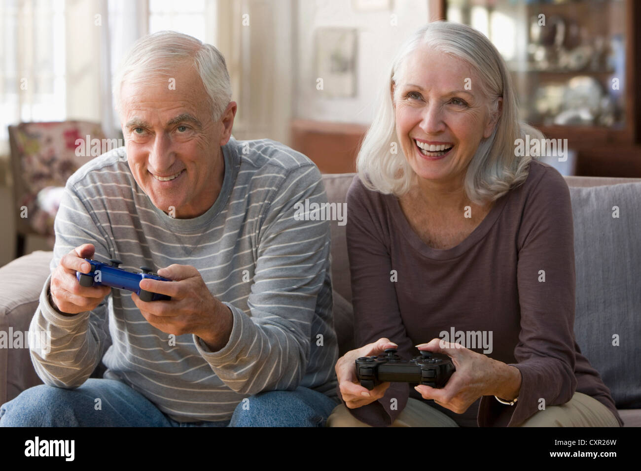Older man playing computer game hi-res stock photography and images - Alamy