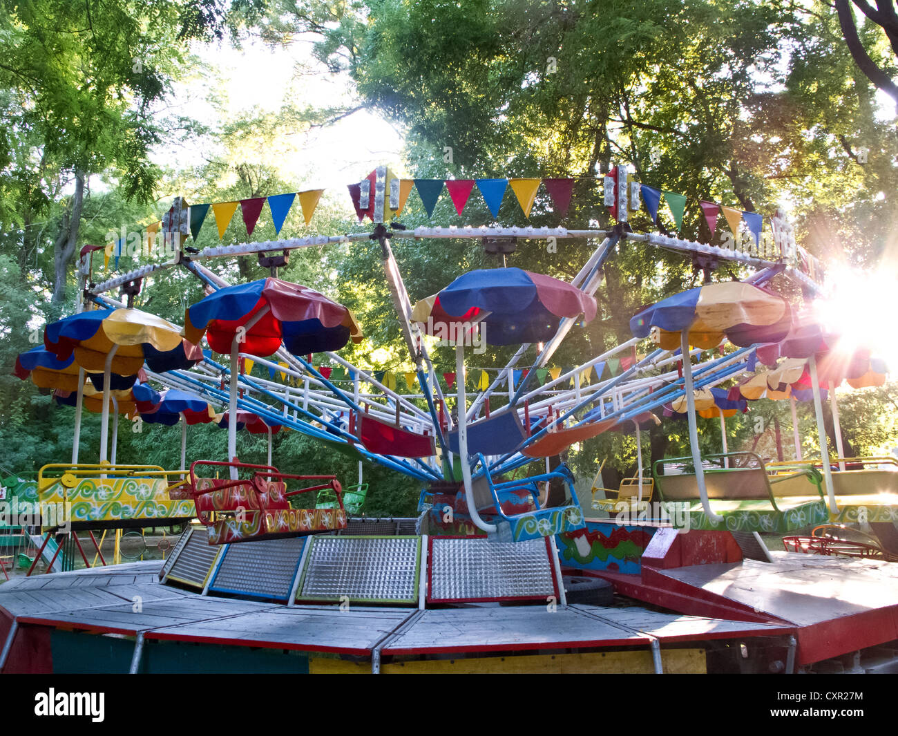 One child spinning playground hi-res stock photography and images - Alamy