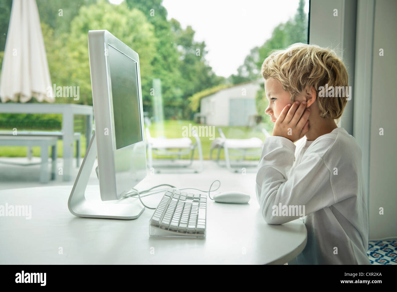 Child staring at computer hi-res stock photography and images - Alamy