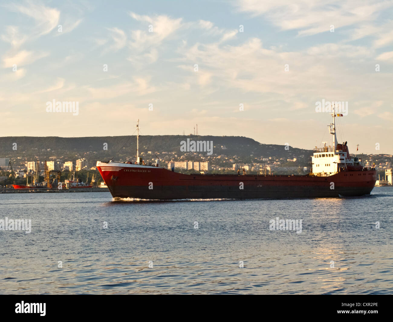 Cargo ship approaching harbor Stock Photo - Alamy