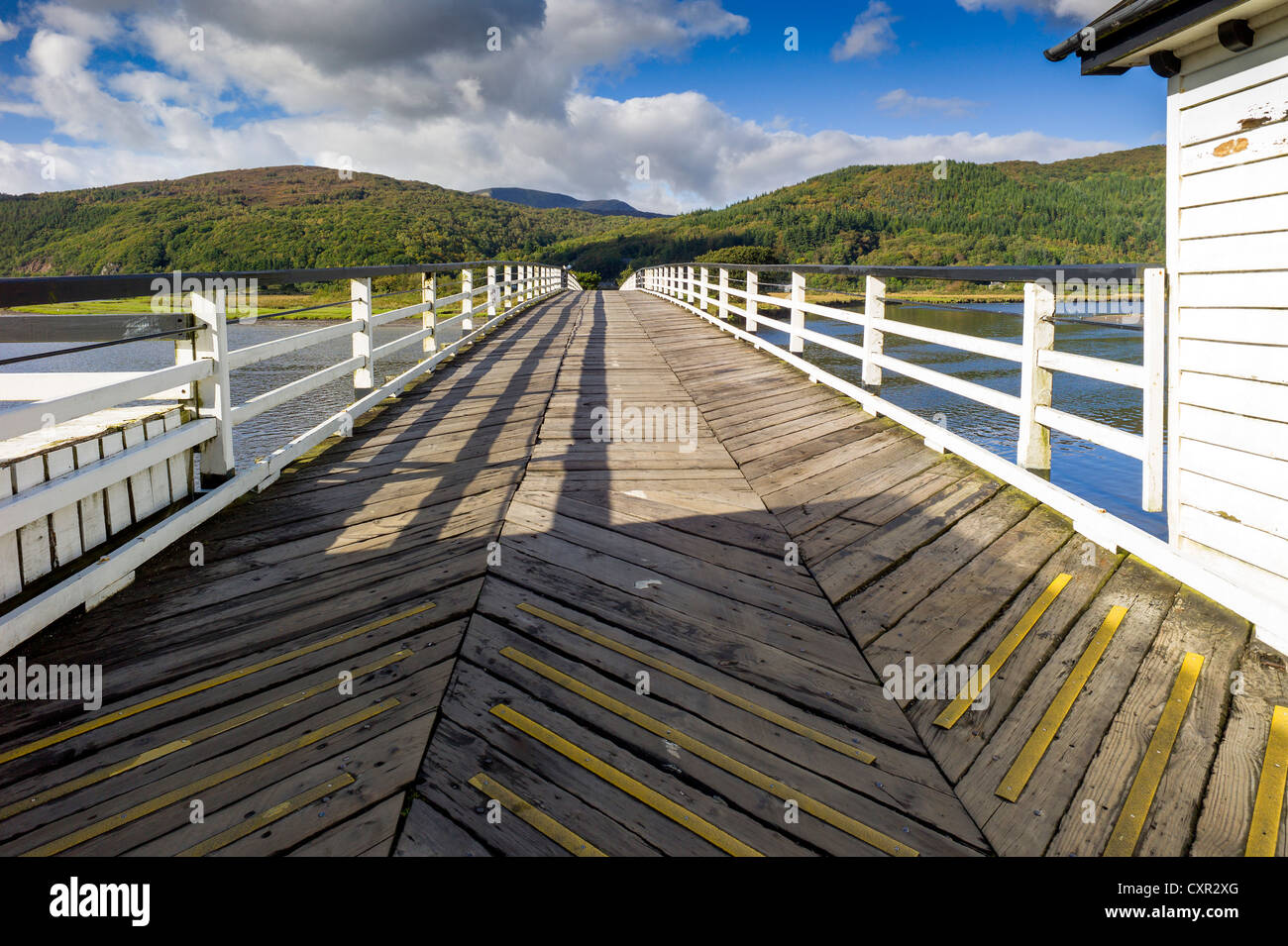 A view looking across an old wooden toll bridge, converging in the ...