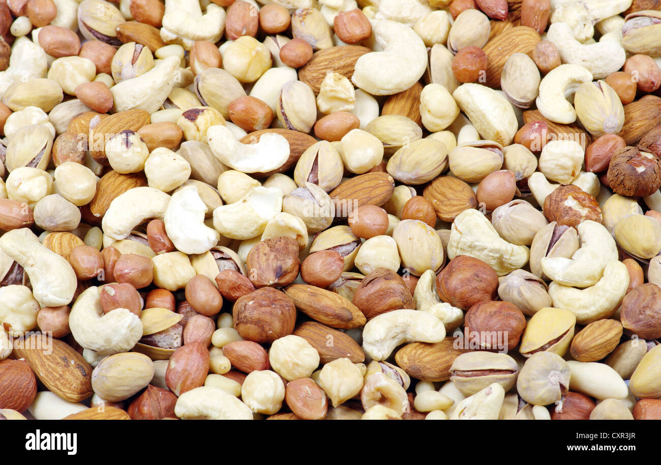 mixed nuts on a background Stock Photo - Alamy