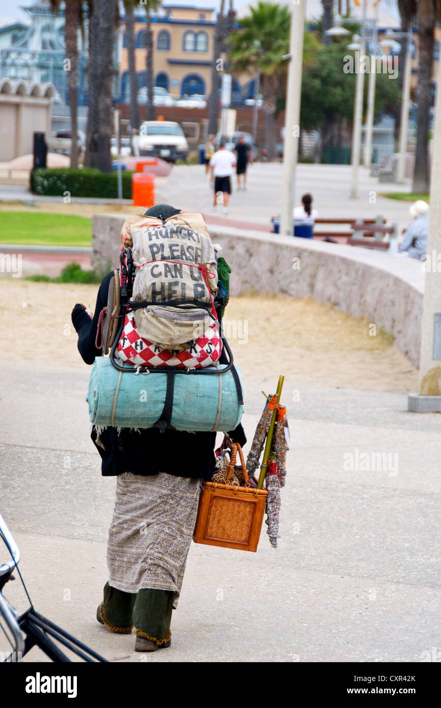 Hungry homeless man walking down street Stock Photo - Alamy