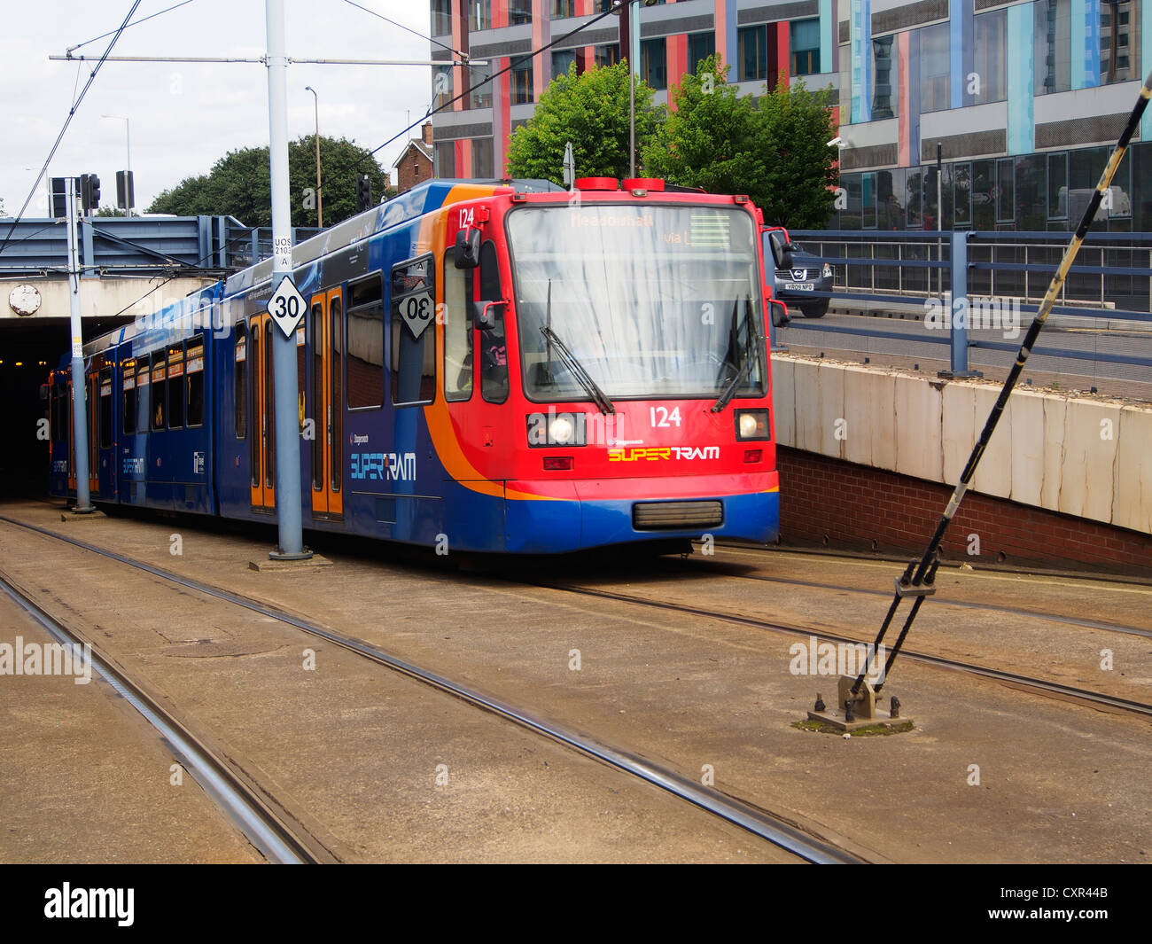 Sheffield electric Supertram emerging from underpass in Sheffield city ...