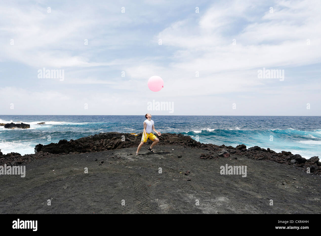 Man with a balloon by the sea, freedom and lightness, Kumukahi ...