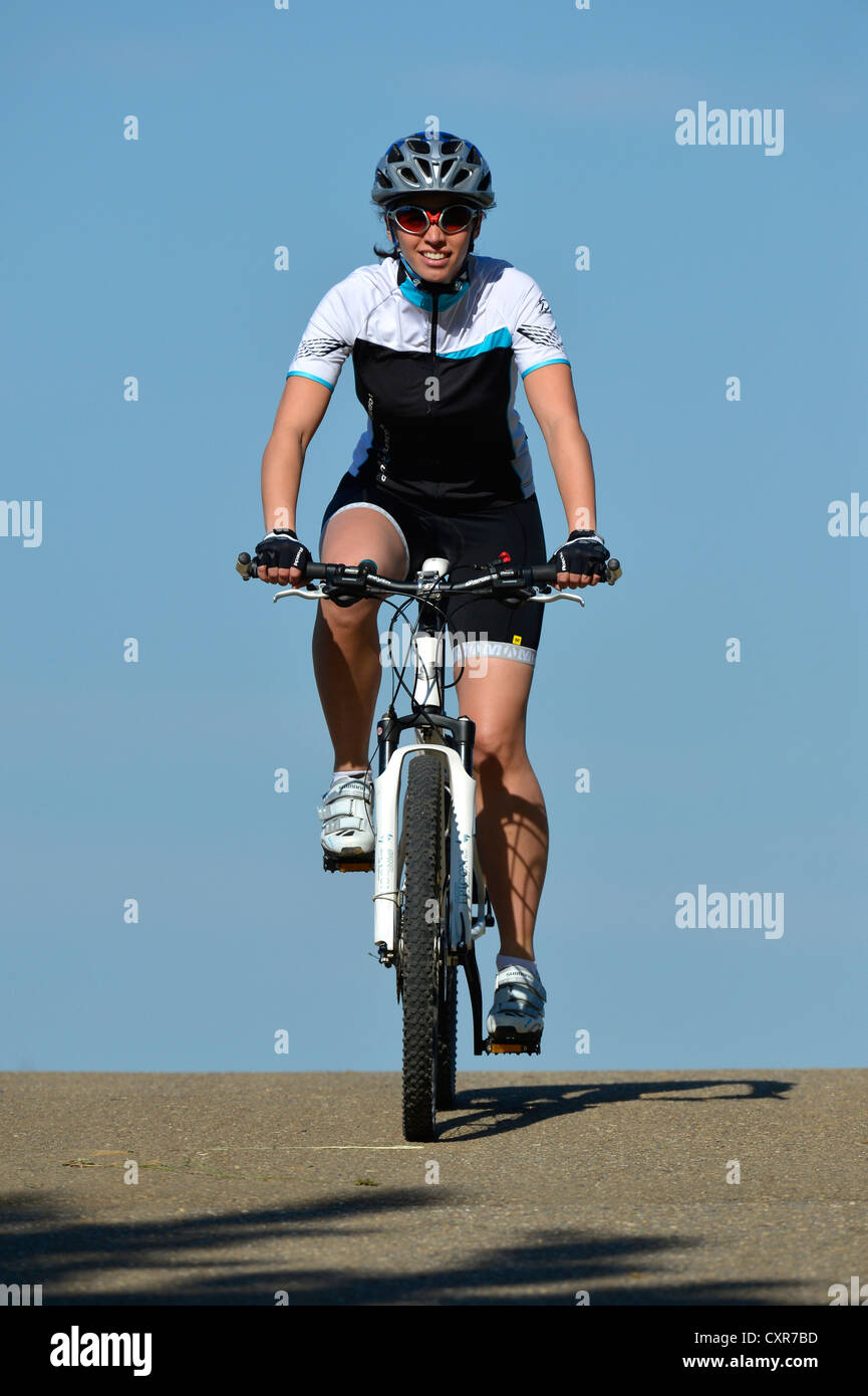 Female cyclist riding a mountain bike, bicycle, Stuttgart, Baden ...