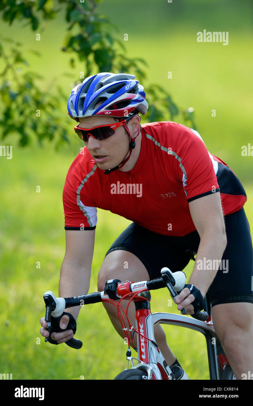 Cyclist riding a high-quality carbon road bike, Weinstadt, Baden ...