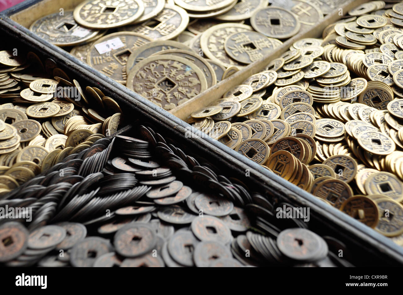 Chinese coin with hole hi-res stock photography and images - Alamy