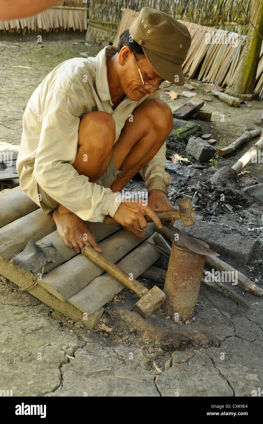 Man forging knives, Can Tho, Mekong Delta, Vietnam, Southeast Asia ...