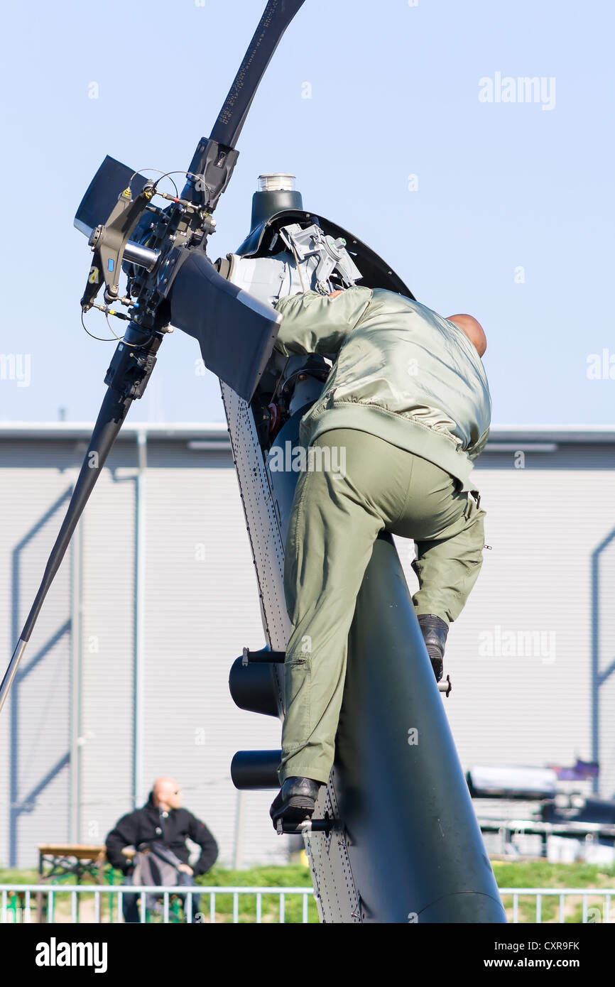 The technician makes servicing the propeller of a military helicopter ...