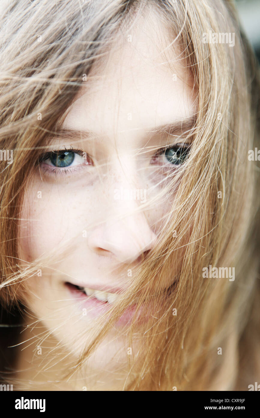 Young woman, hair blowing in the wind, portrait Stock Photo - Alamy