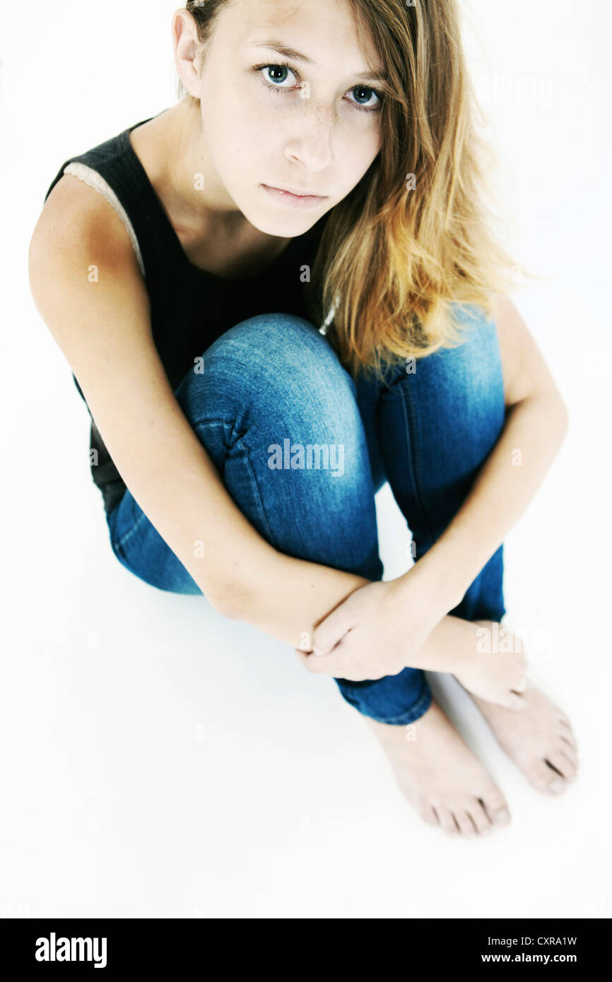 Young woman, seated Stock Photo - Alamy