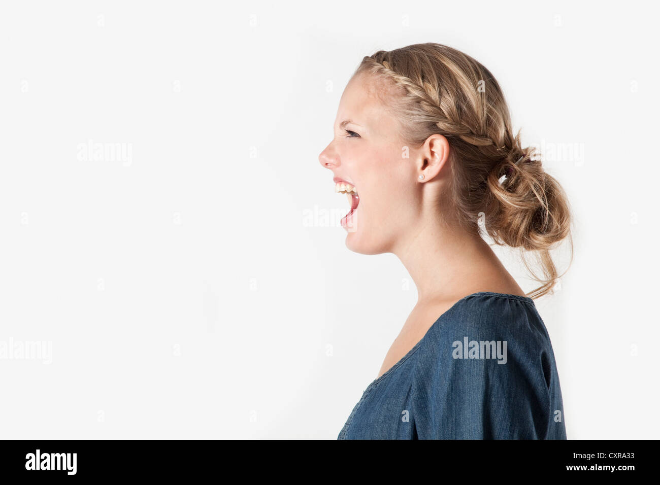 Young woman shouting Stock Photo - Alamy