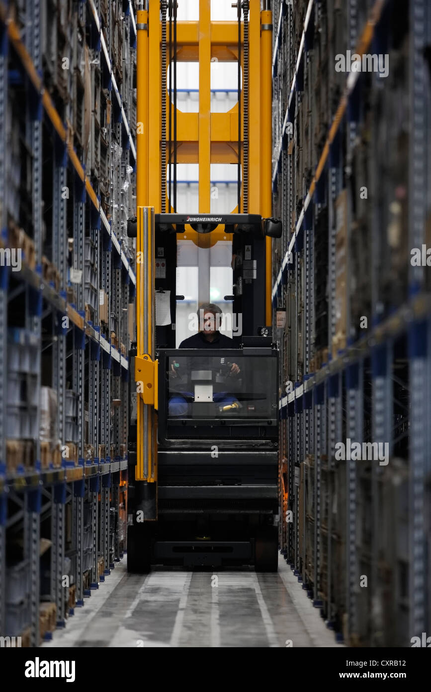 Computer-controlled forklift in the high-bay storage warehouse at J ...