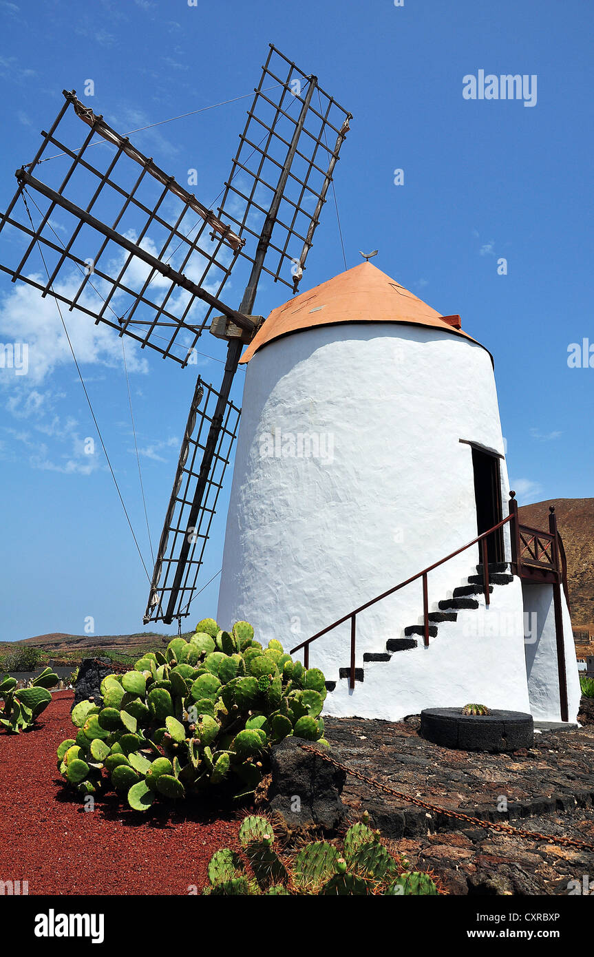 Old Spanish wind mill on the blue sky Stock Photo - Alamy