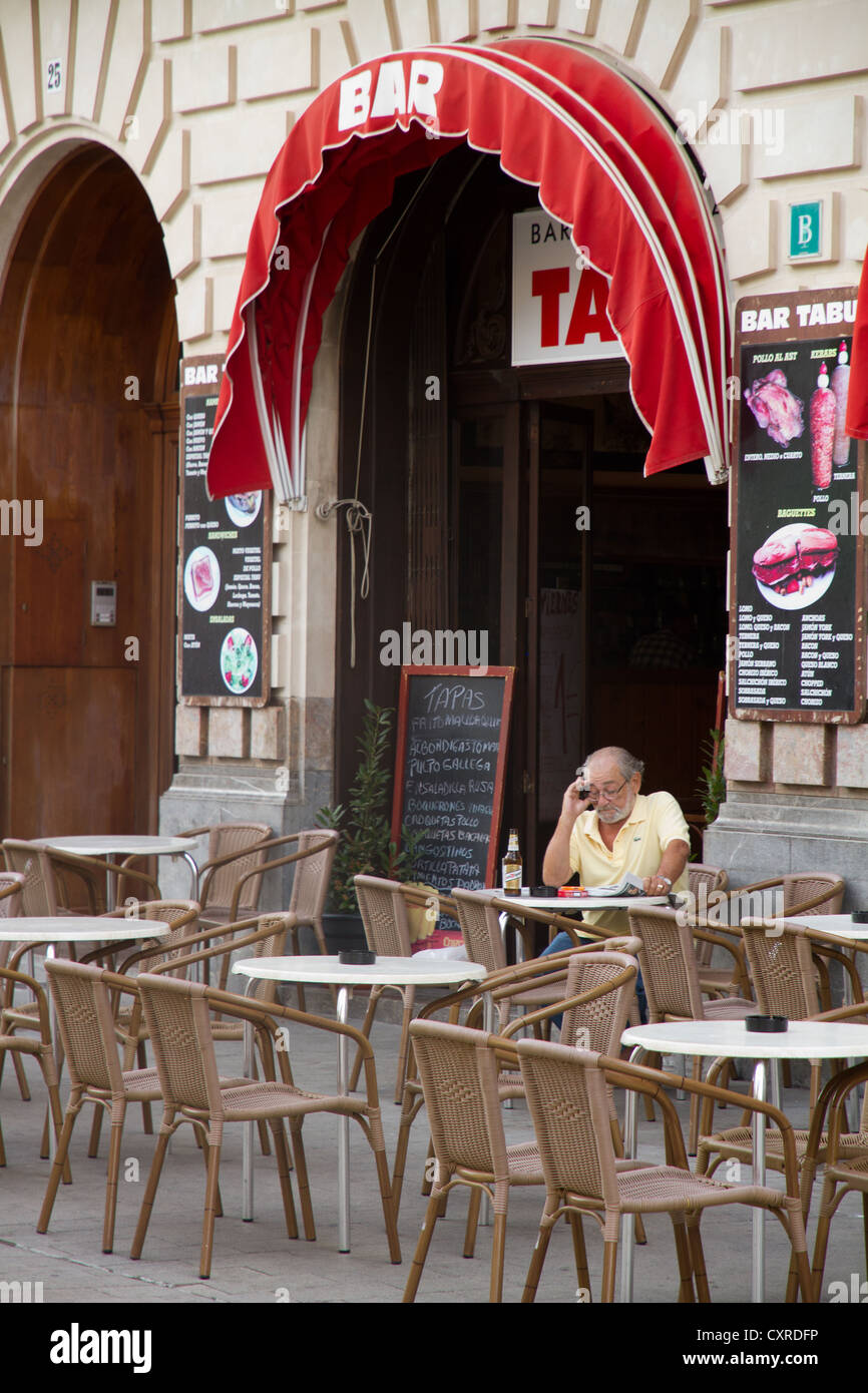 man reading sitting in Bar cafeteria Lllucmajor Mallorca Balearic ...