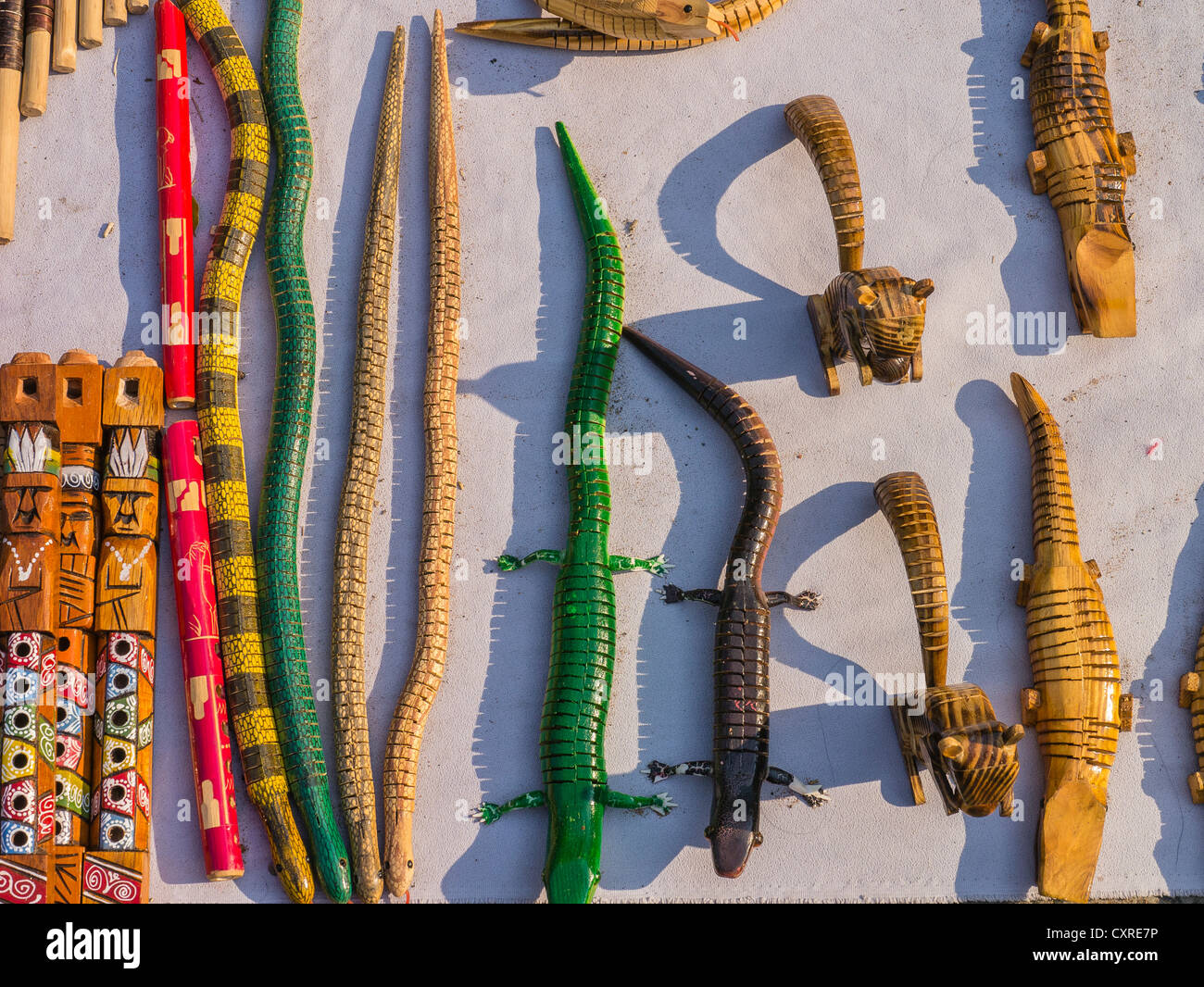 A display, as viewed from above of colorful hand carved wooden animals ...