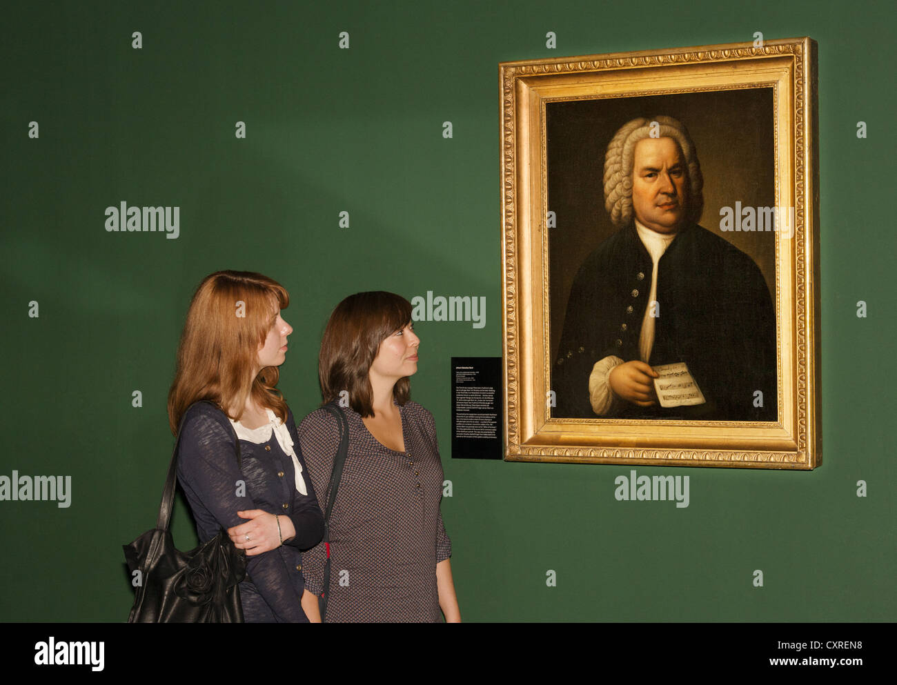 Visitors standing in front of the portrait of Johann Sebastian Bach ...