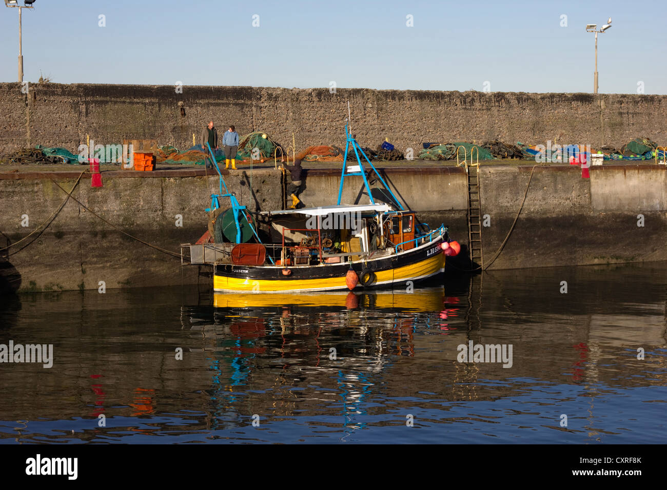 Fishing boat moored in Port Seton harbour Stock Photo - Alamy
