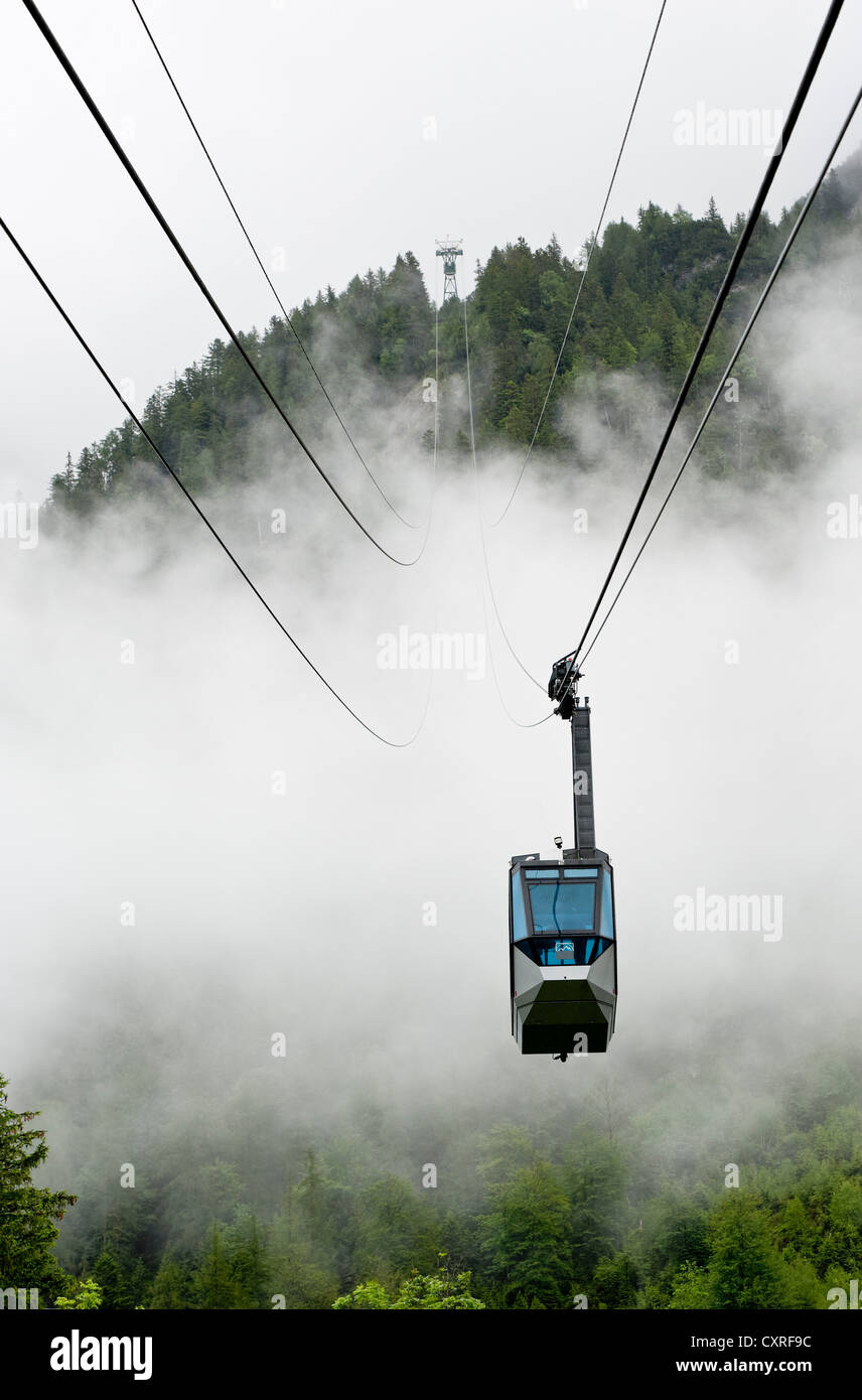 The steel cables of the Karwendel Cable Car disappearing in the clouds ...