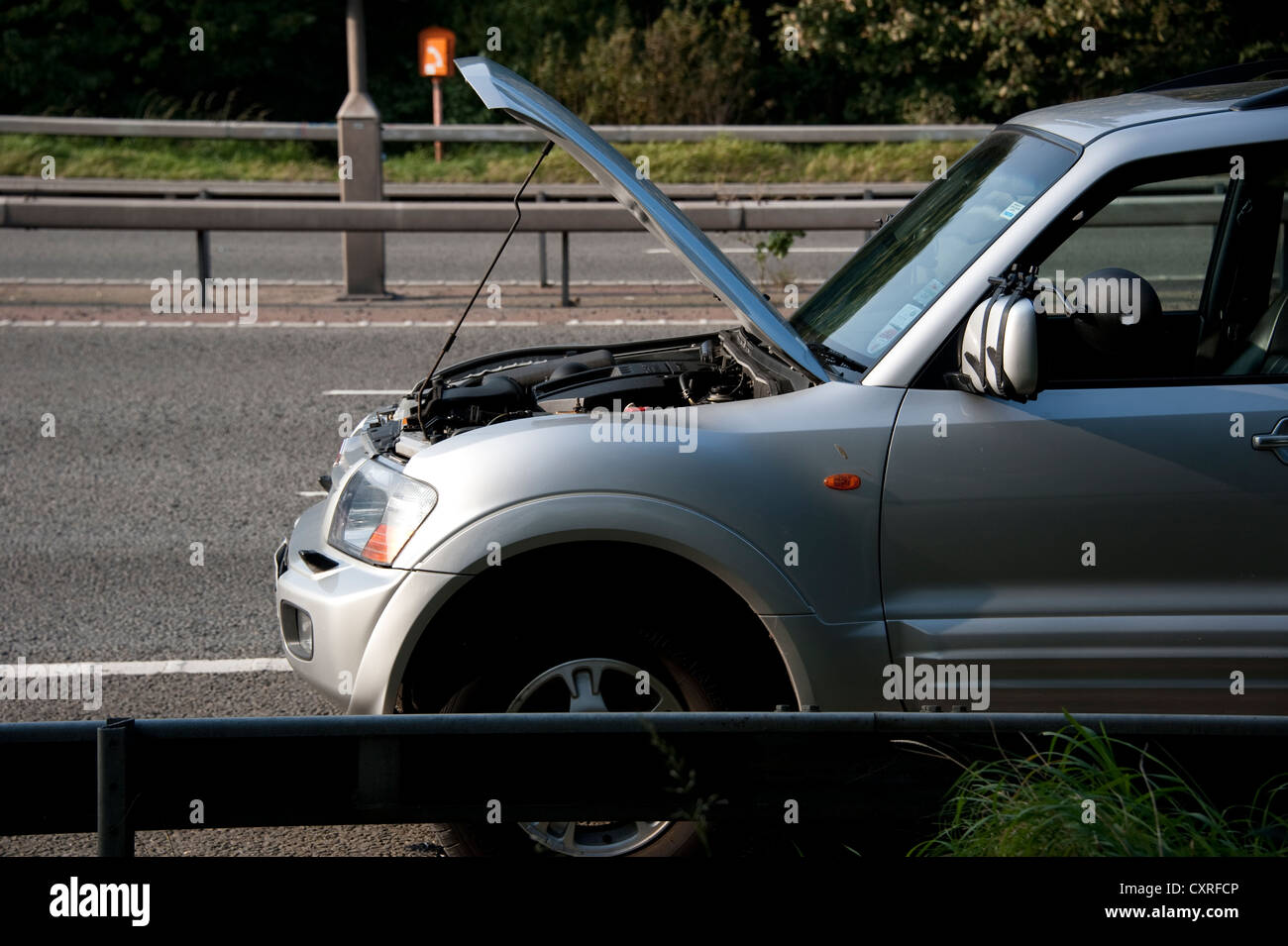 Mitsubishi Shogun Car broken down on hard shoulder of motorway UK Stock ...