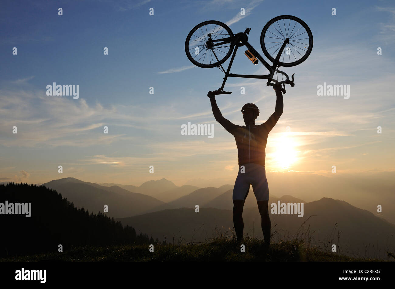Cyclist holding bike above head High Resolution Stock Photography and ...