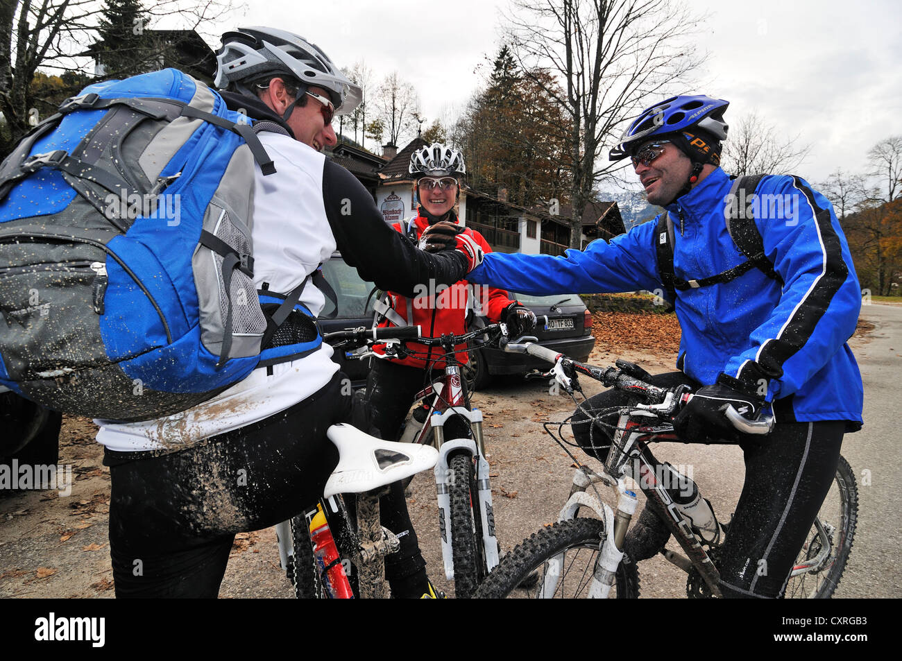 Mountain bikers saying good bye after a successful trip, district of ...
