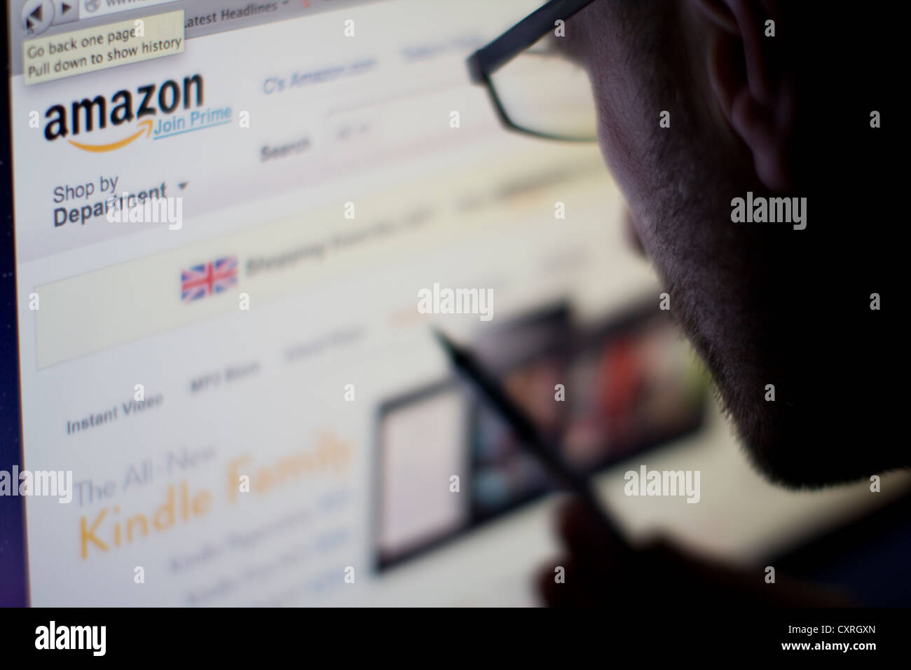 Close-up of a man browsing the Amazon website—highlighting e-commerce ...