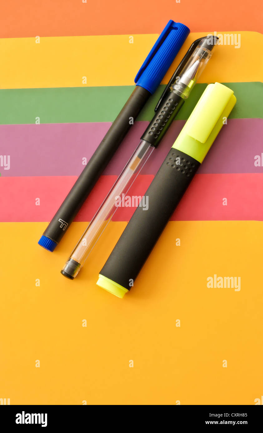 Highlight pens on a colorful background Stock Photo - Alamy