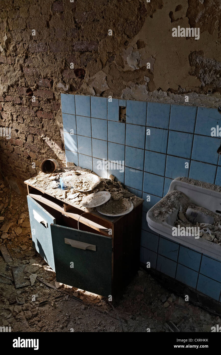 Dilapidated room with a sink in an abandoned building, disused ...