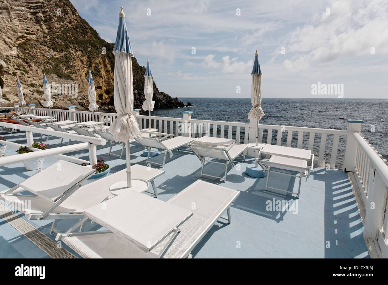 Sun terrace with sunloungers, Bay of Sorgeto, near Panza, Forio, Ischia ...