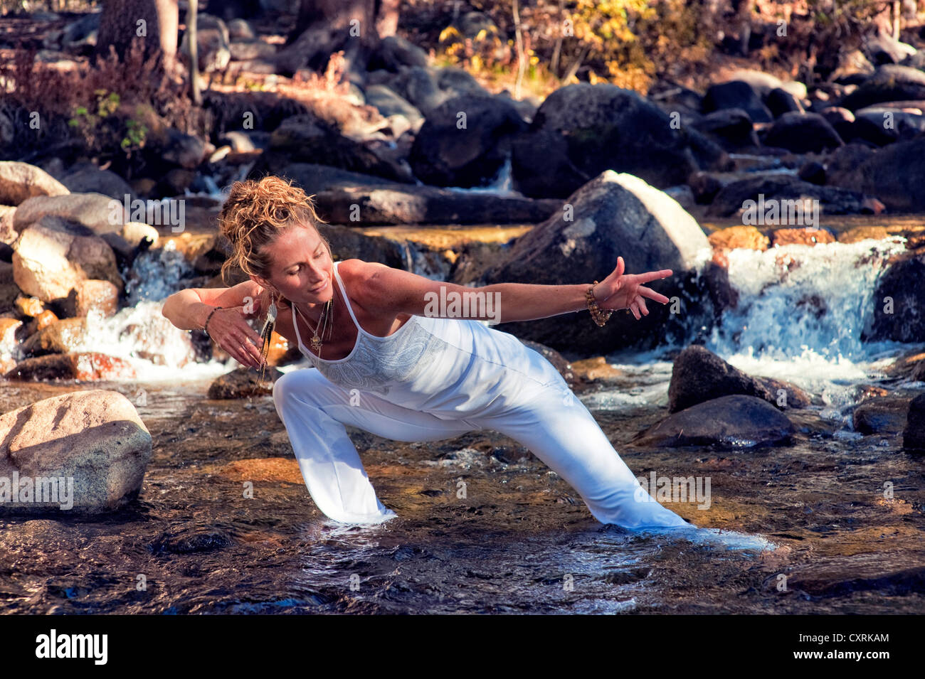 River energy dancing. Woman in white Stock Photo - Alamy
