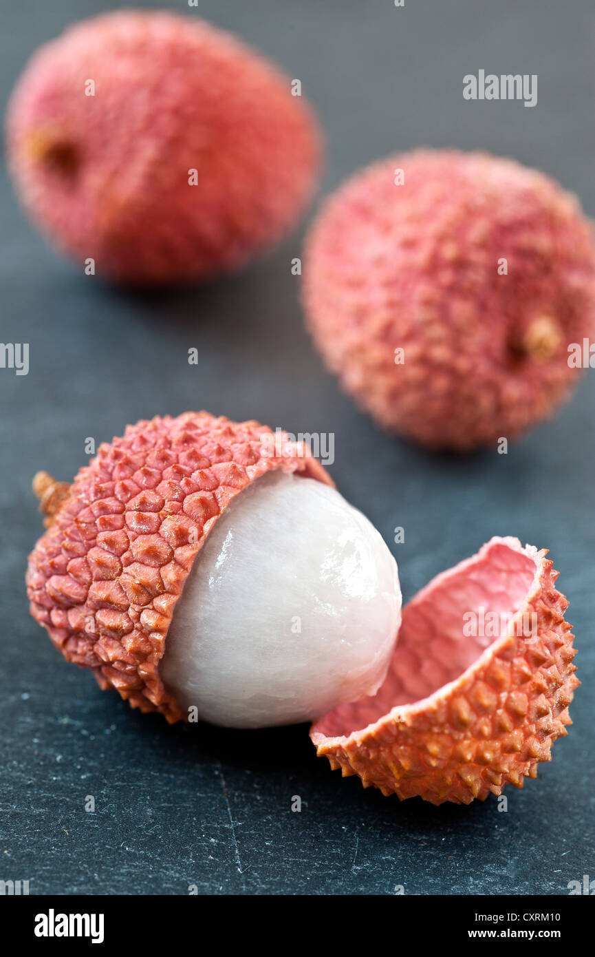 Lychees, whole and partially peeled Stock Photo - Alamy